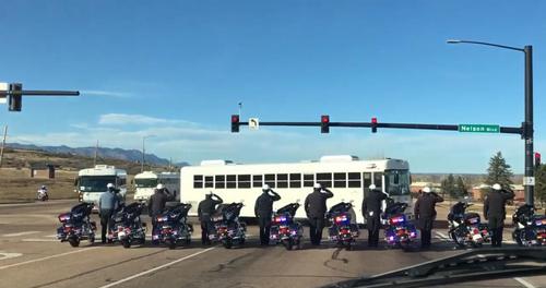 Police Officers Block A Busy Highway Leaving The Special Bus